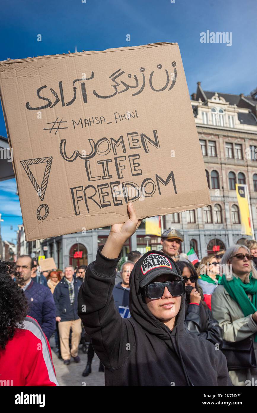 Amsterdam, Netherlands. 16th Oct, 2022. A woman holds up a placard ...