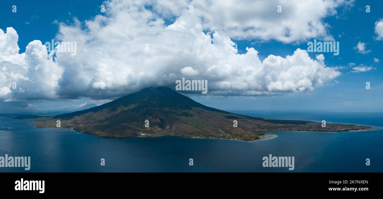 Clouds gather above the active volcano of Iliape in the Lesser Sunda ...