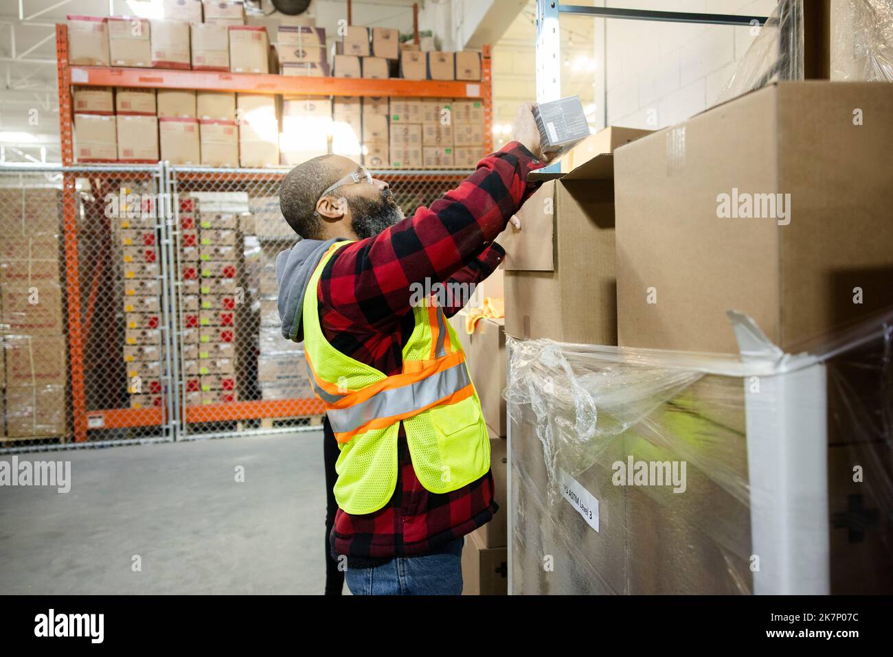 Man reaching into box hi-res stock photography and images - Alamy