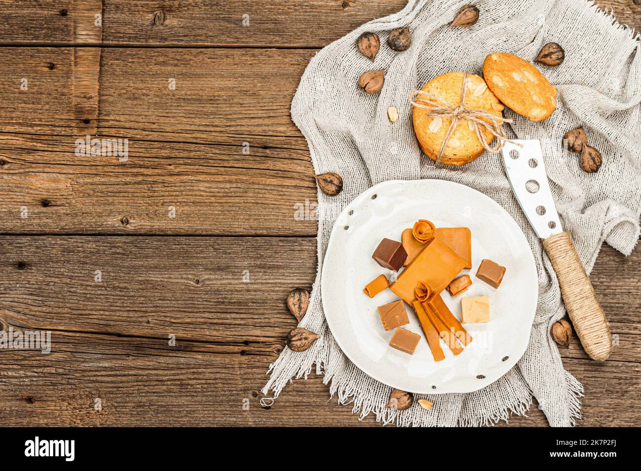 Norwegian brunost with cookies and nuts. Healthy food and eating ...