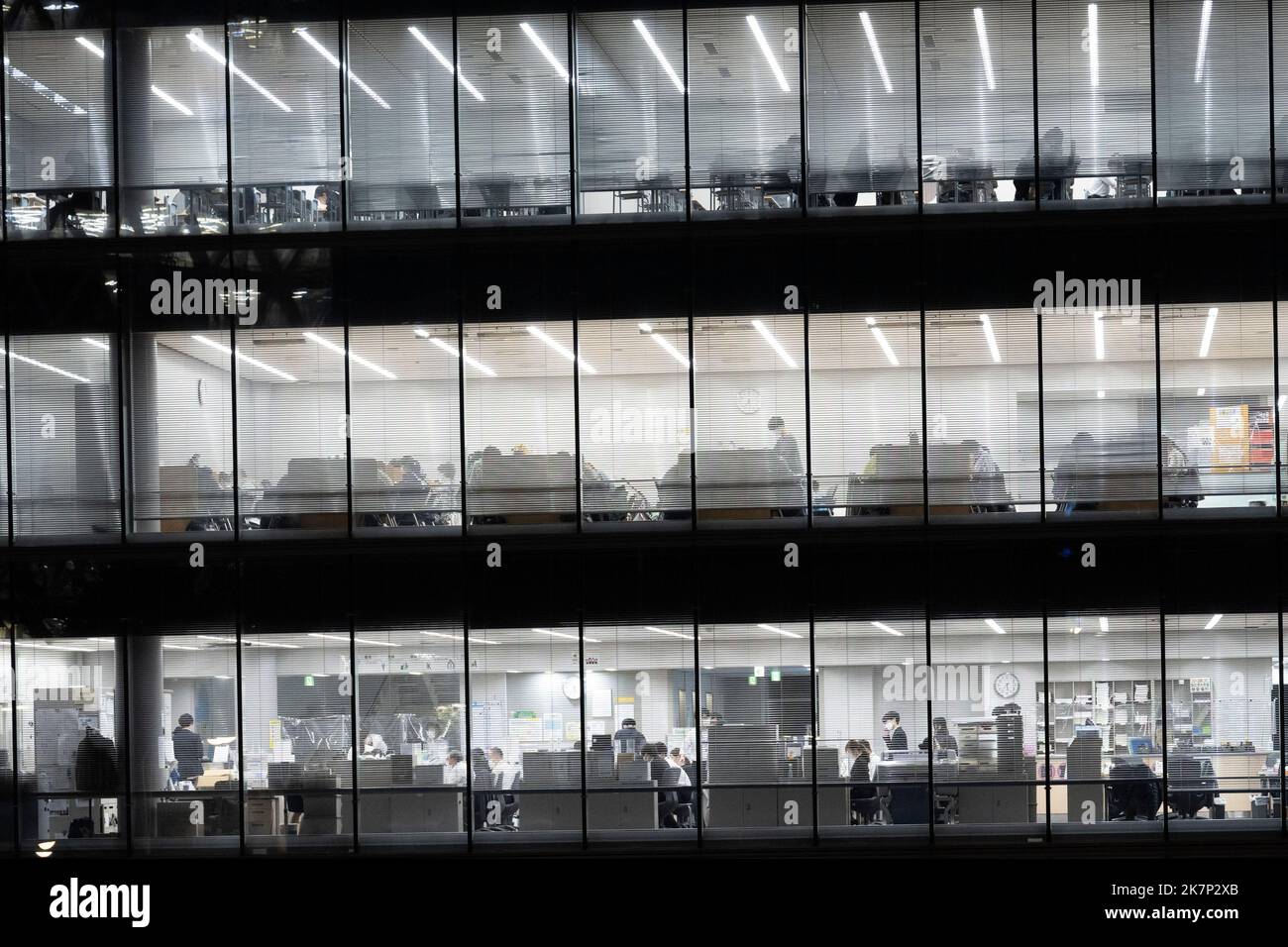 Tokyo, Japan. 18th Oct, 2022. Office workers spending a late night at ...