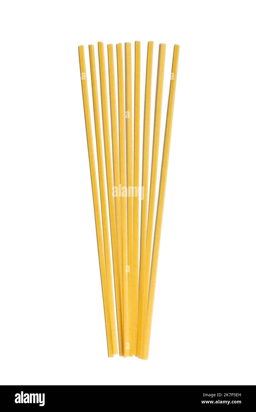 Pile of uncooked durum fettuccine pasta isolated on white background ...