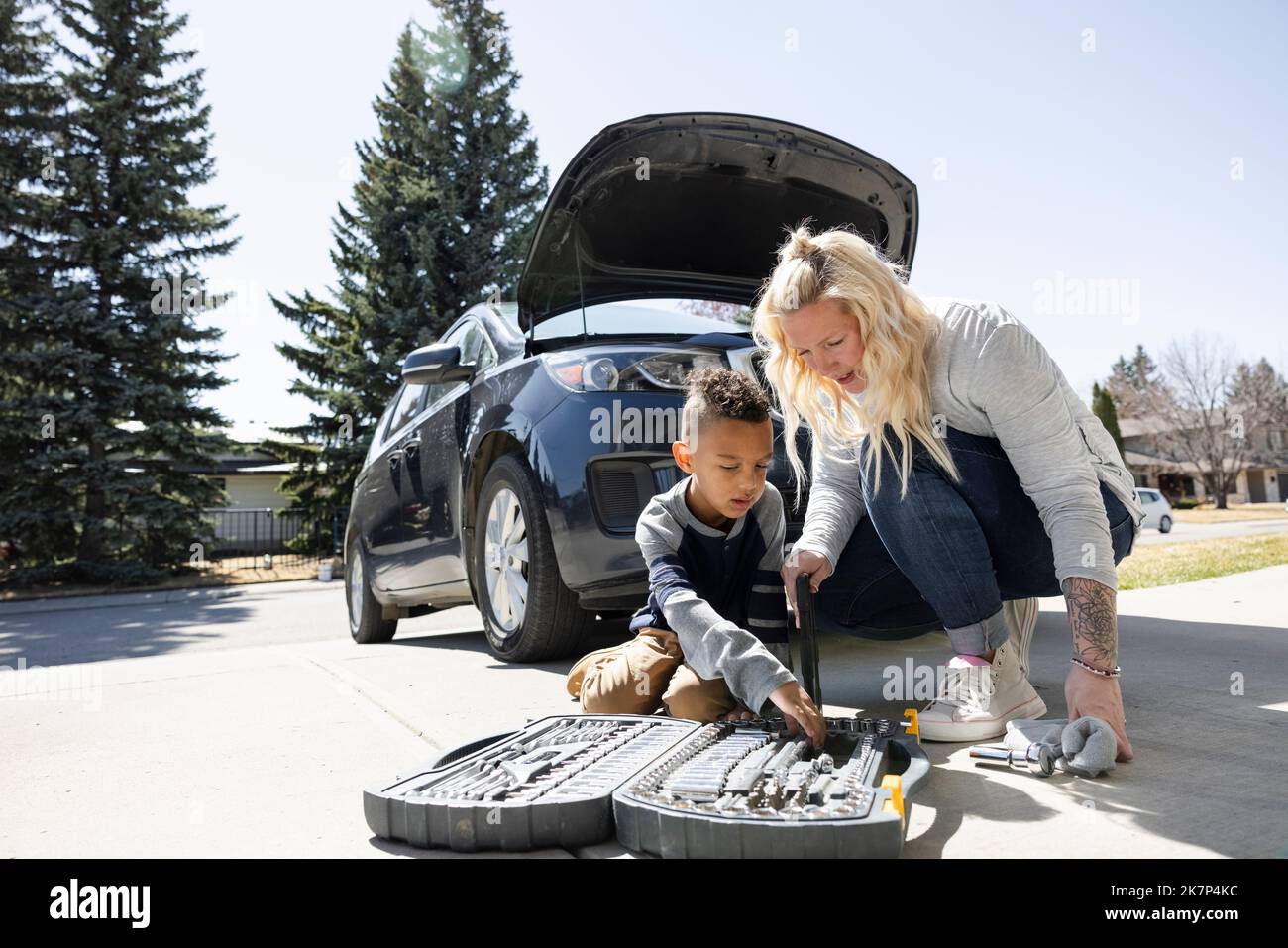 Son helping mother hi-res stock photography and images - Alamy