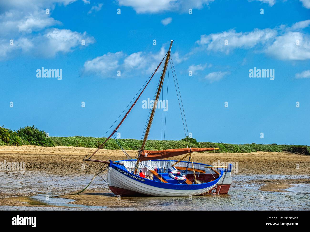 Burnham Overy Staithe, Norfolk, UK, boat at low tide in the harbour ...