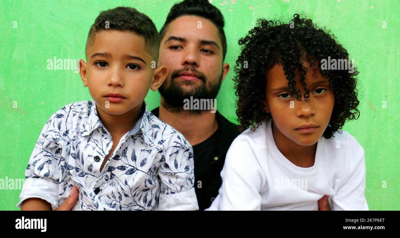 Hispanic father with kids. Brazilian people, serious expression. south ...