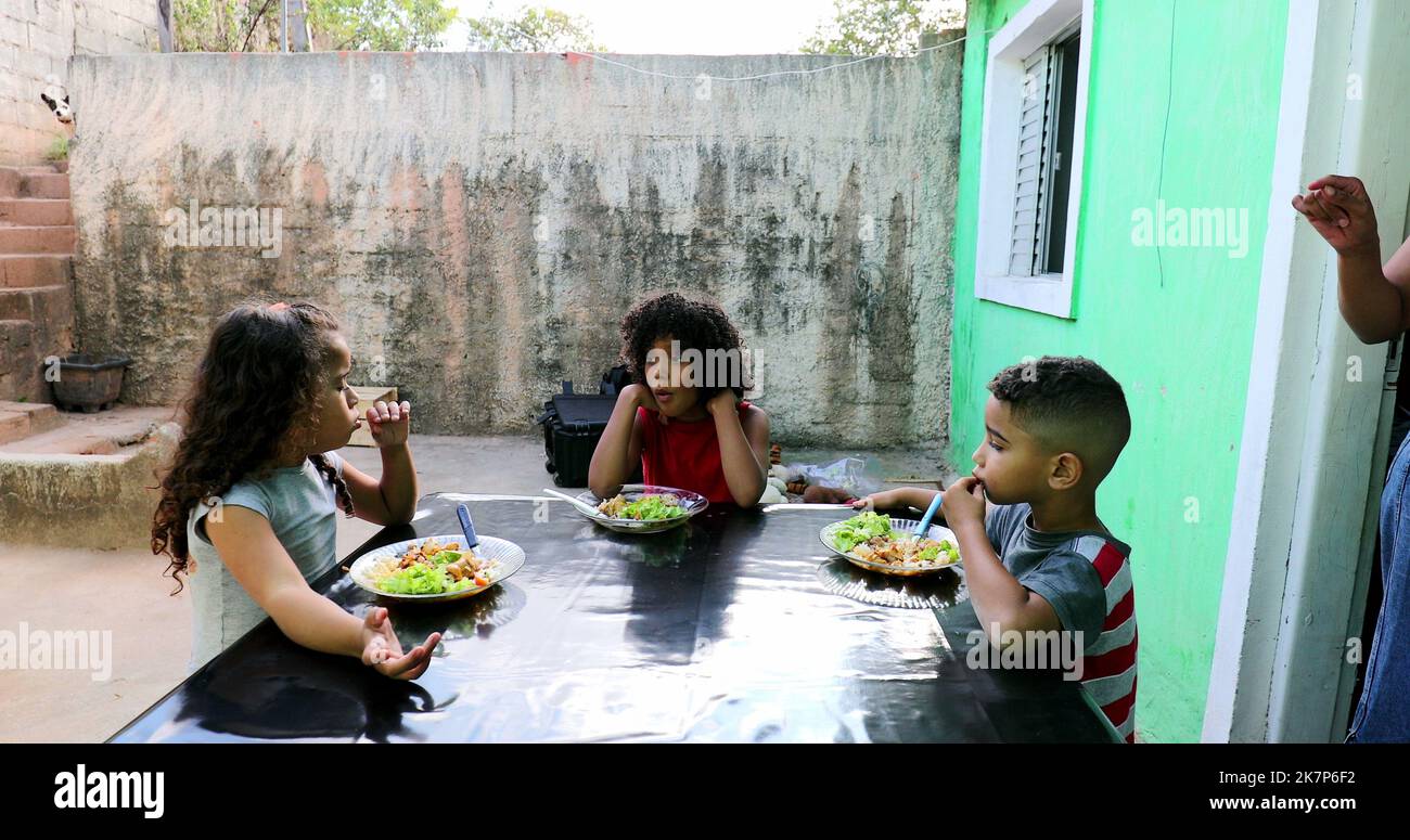 Hispanic kids eating lunch, Brazilian south american children eat meal ...