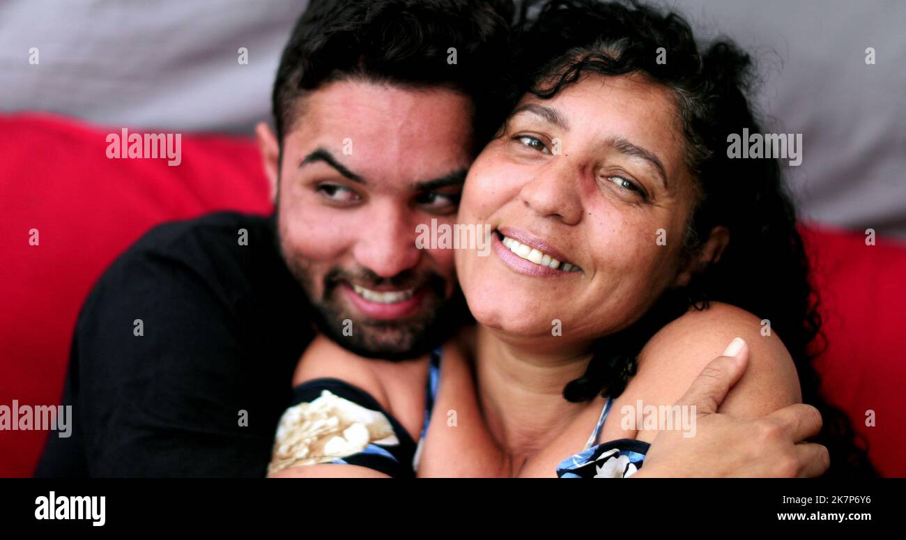 Latin mature mother kissing son. South American hispanic people love ...