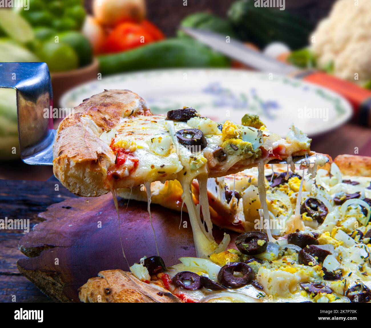 Slice of melting mozzarella pizza Stock Photo - Alamy