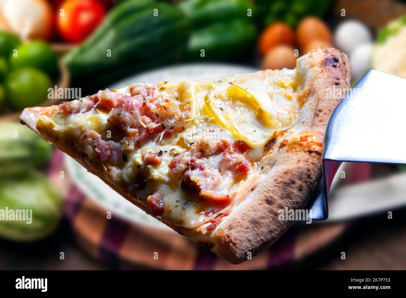 Pizza slice with mozzarella and bacon Stock Photo - Alamy