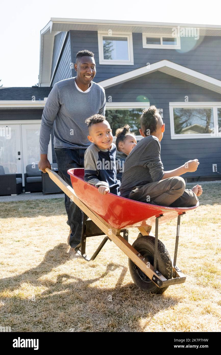 Wheelbarrow children wheelbarrow hi-res stock photography and images ...