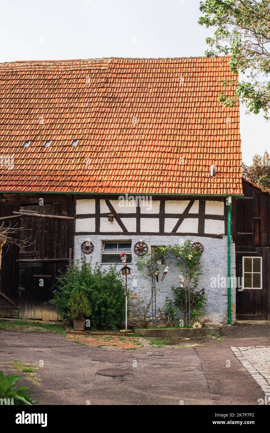 Traditional small house with beautiful outdoor decor facade in Germany ...