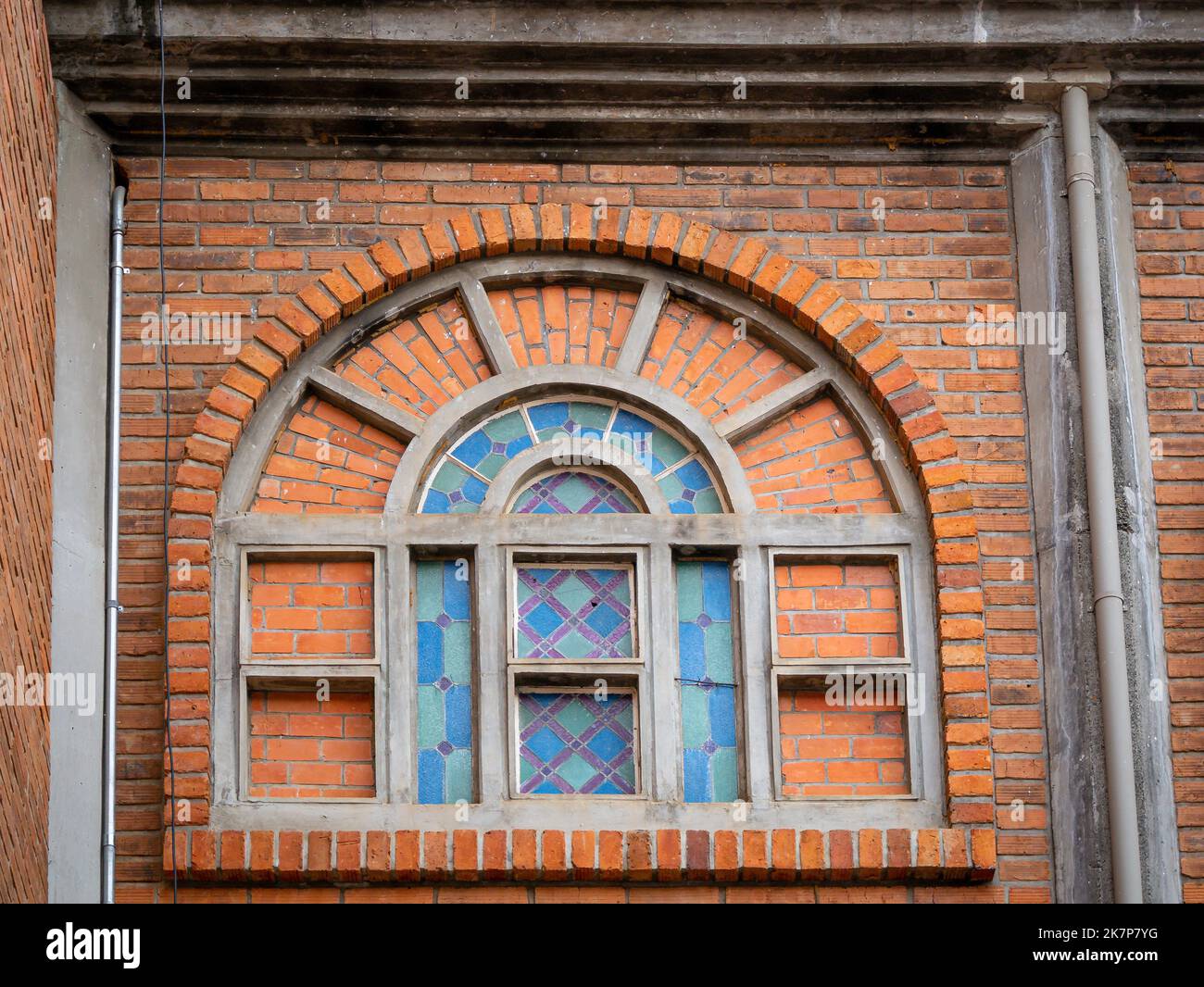 Window with Several Different Colored Panes of Glass of a Brick Church ...