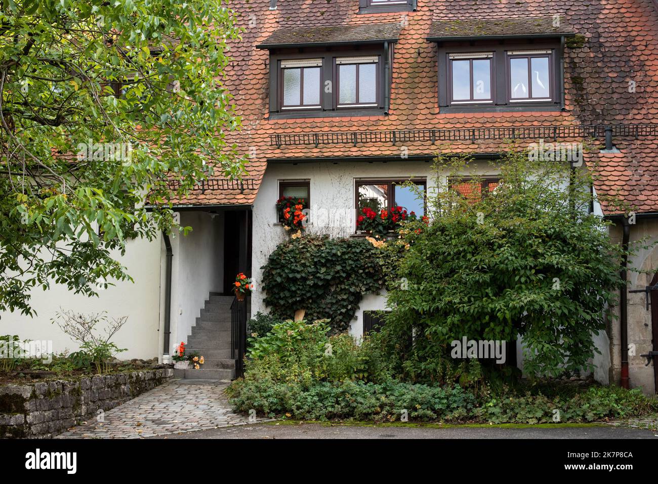 Traditional small house with beautiful outdoor decor facade in Germany ...