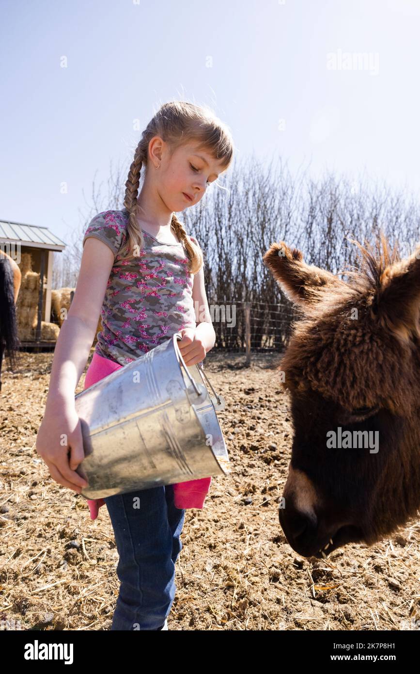 Child in bucket hi-res stock photography and images - Alamy