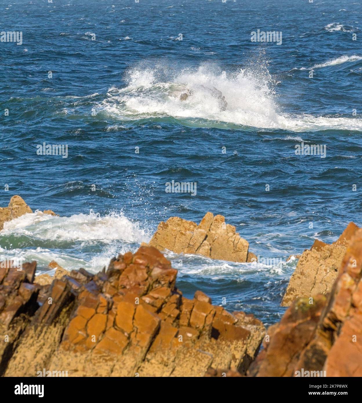 Waves crashing against rocks at Cullen Bay, Scotland, UK Stock Photo - Alamy