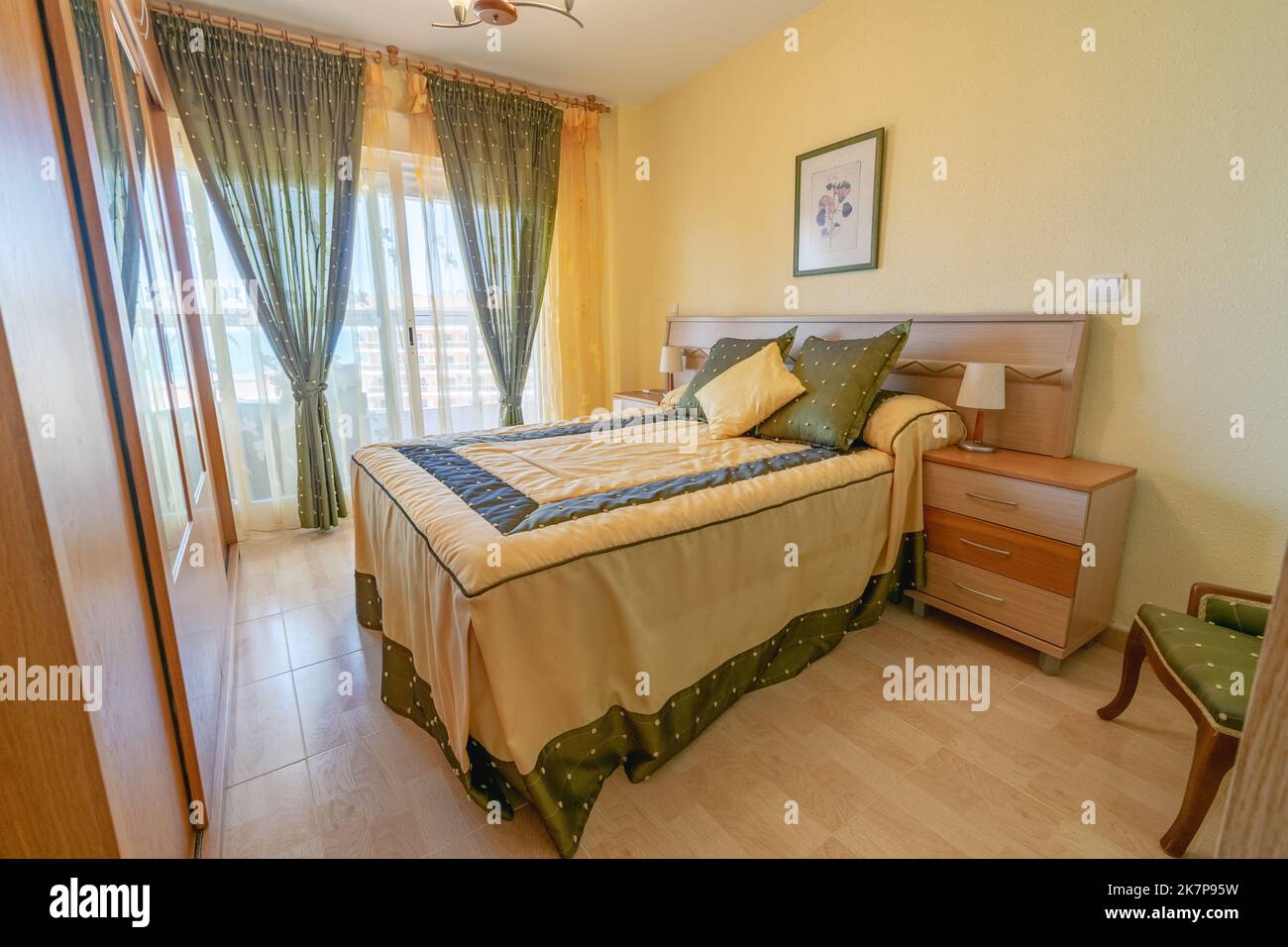 a simple decorated bedroom inside a holiday apartment along the Costa ...