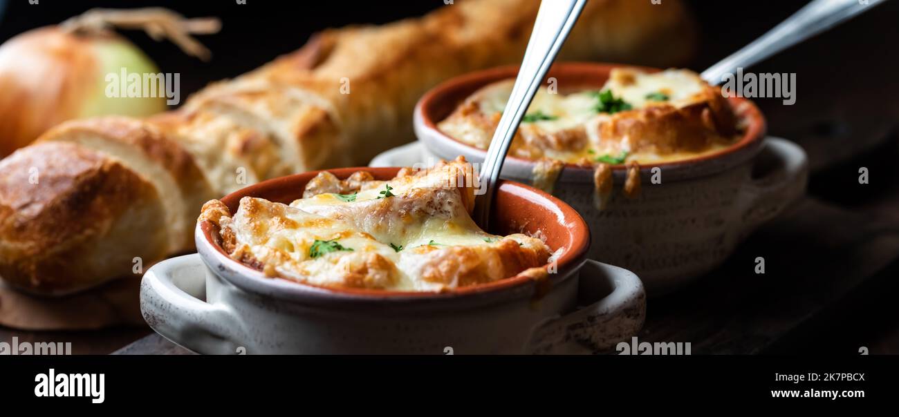 Close up of French onion soup in soup crocks ready for eating, with a ...