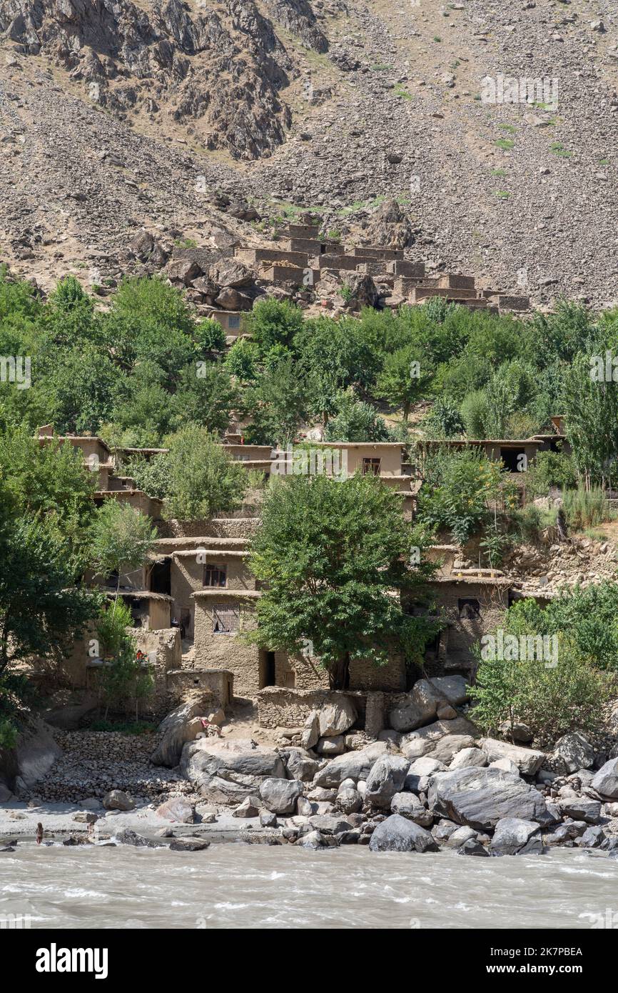 Vertical view of remote traditional Afghan village on mountain side ...