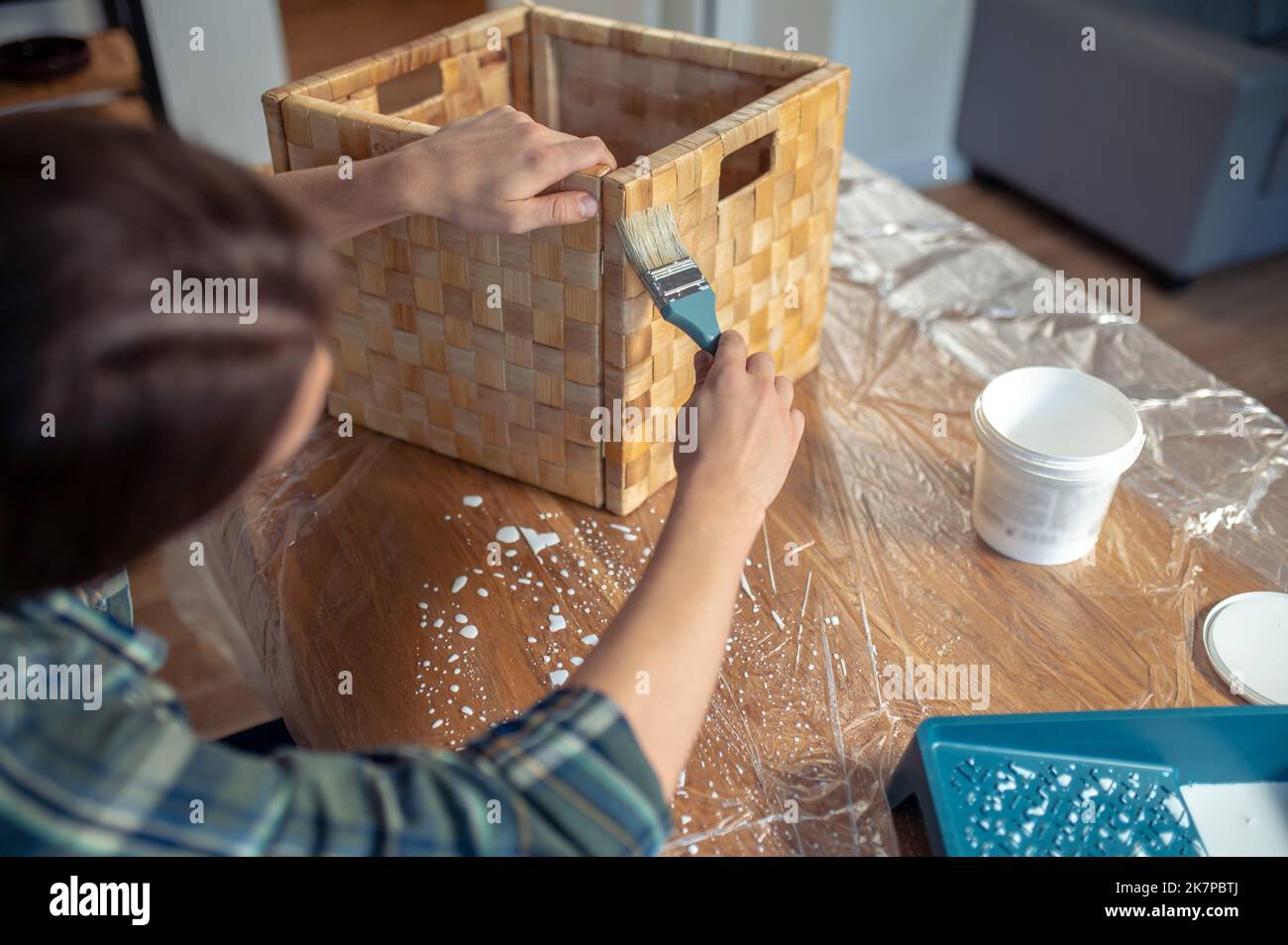 Skilled carpenter painting the exterior of the handmade box Stock Photo ...