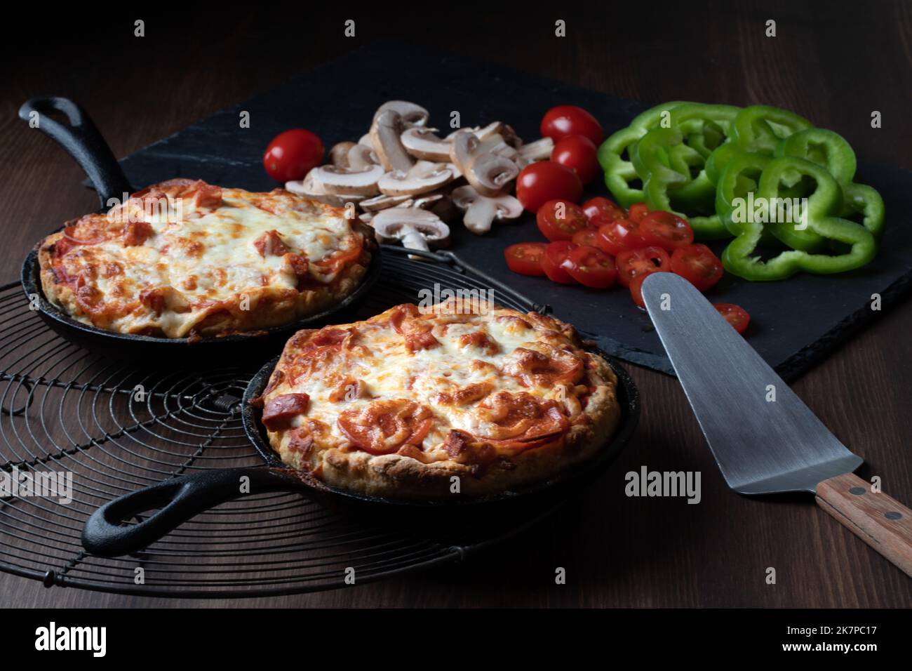 Close up of two individual pepperoni pan pizzas ready for eating Stock ...