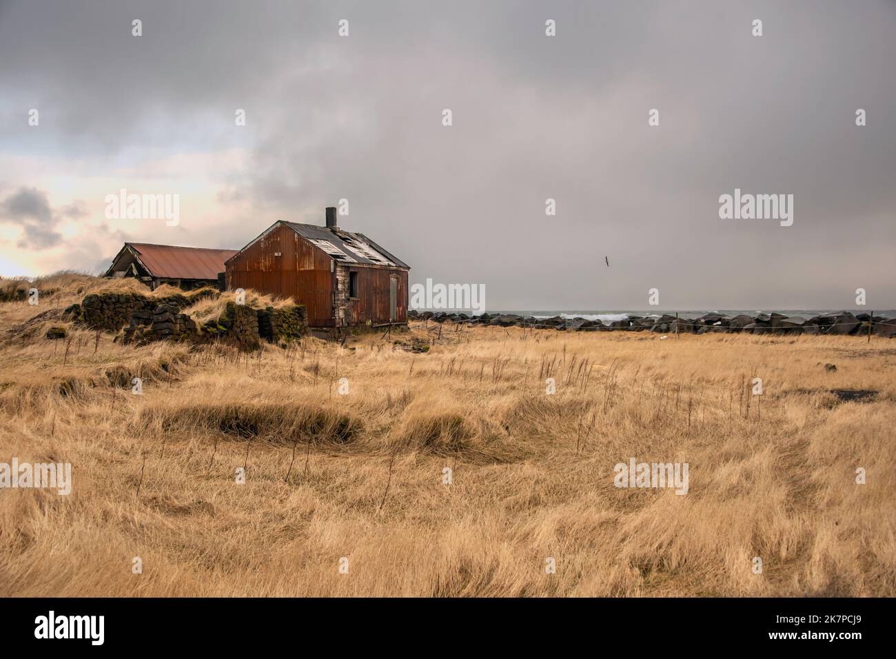 Old sod house and barn on a stormy day, Hafnir, Reykjanes Peninsula ...