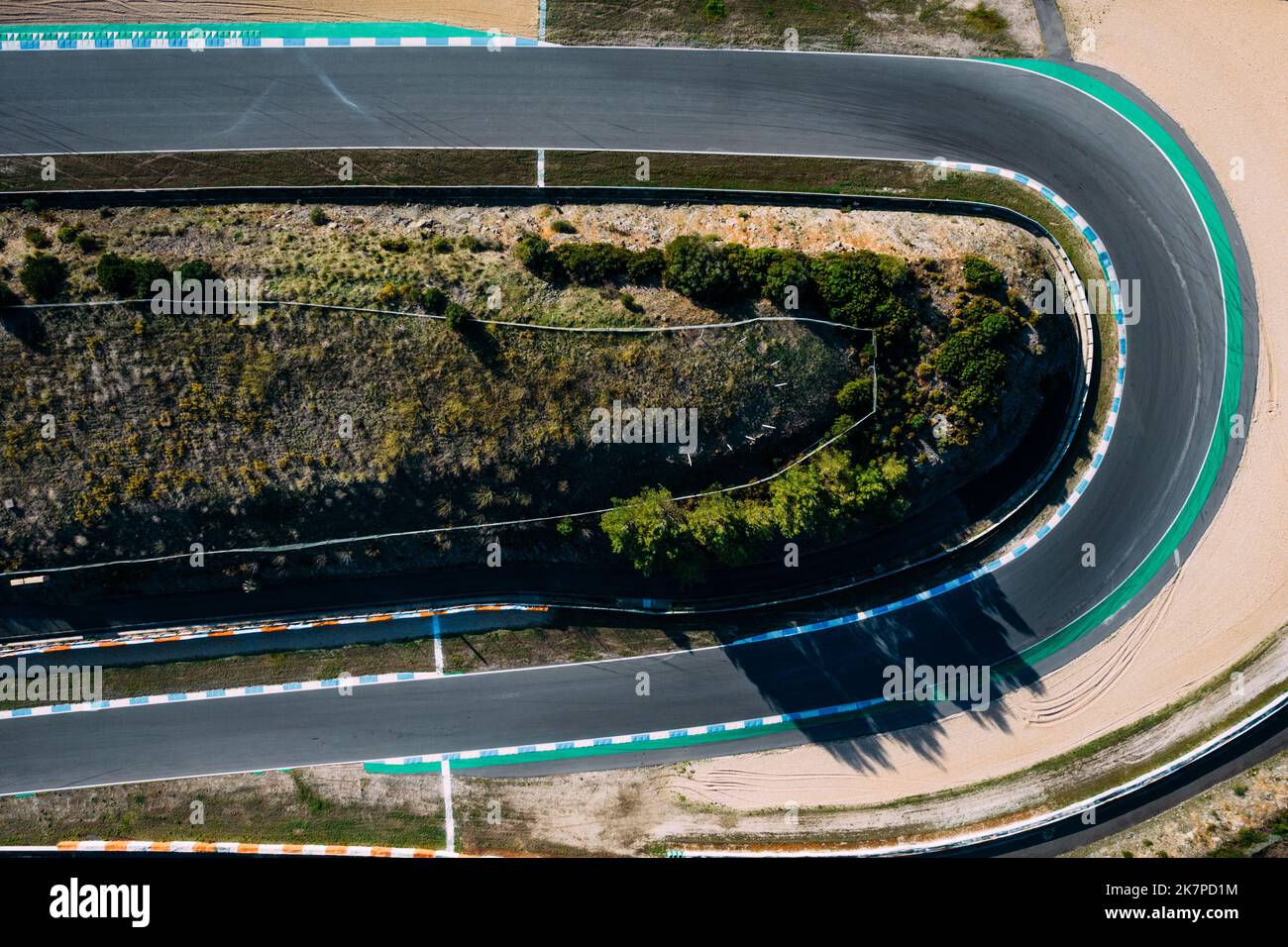 Aerial top down drone view of an empty racing track with tight turns ...