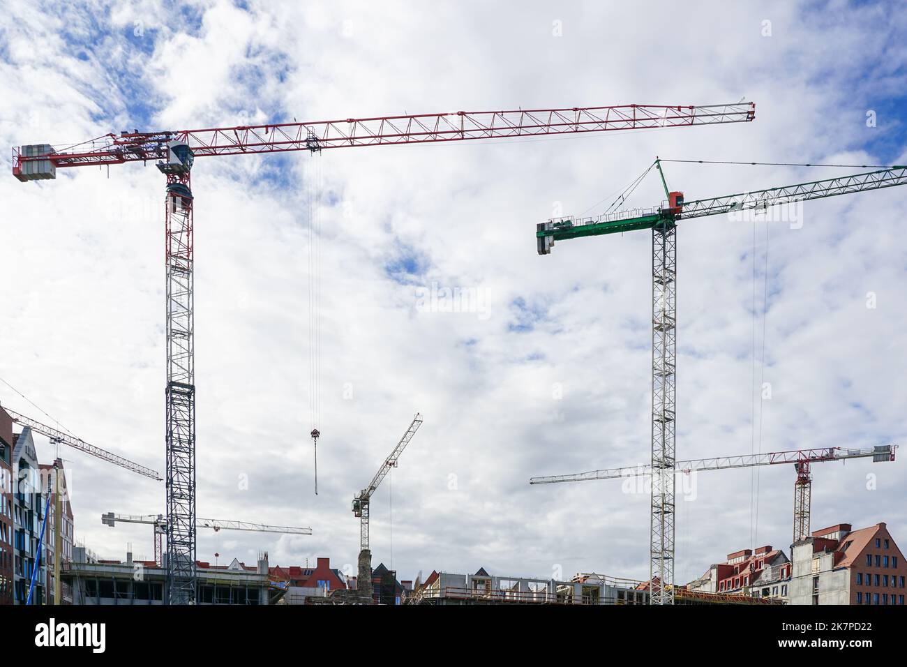 Several tall construction tower cranes in city construction sites ... Several tall construction tower cranes in city construction sites ...