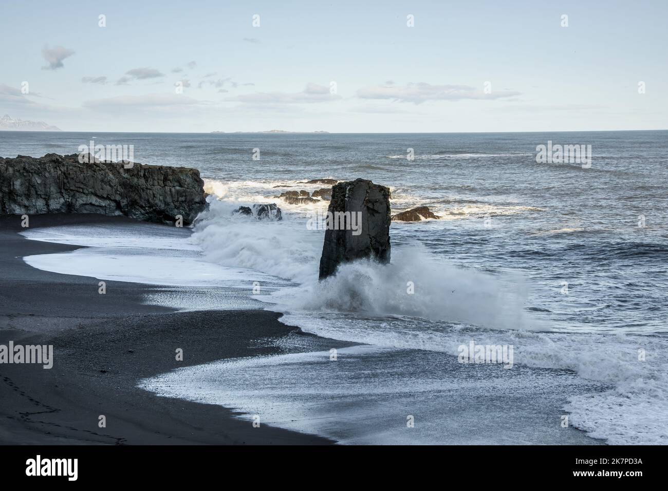 Laekjavik coast line with basaltic pillar and offshore Papaey bird ...