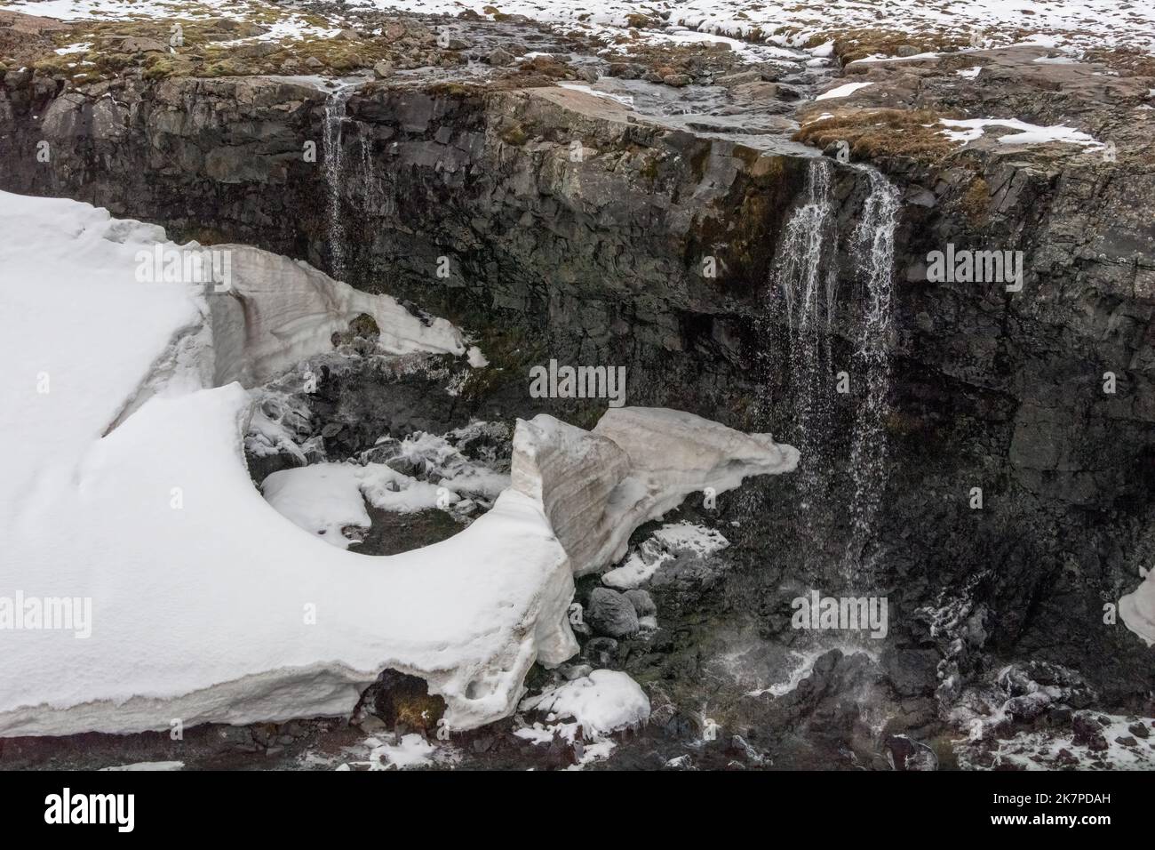 Water sculpted snow, Kuvernufoss from above, Kverna River, Iceland ...