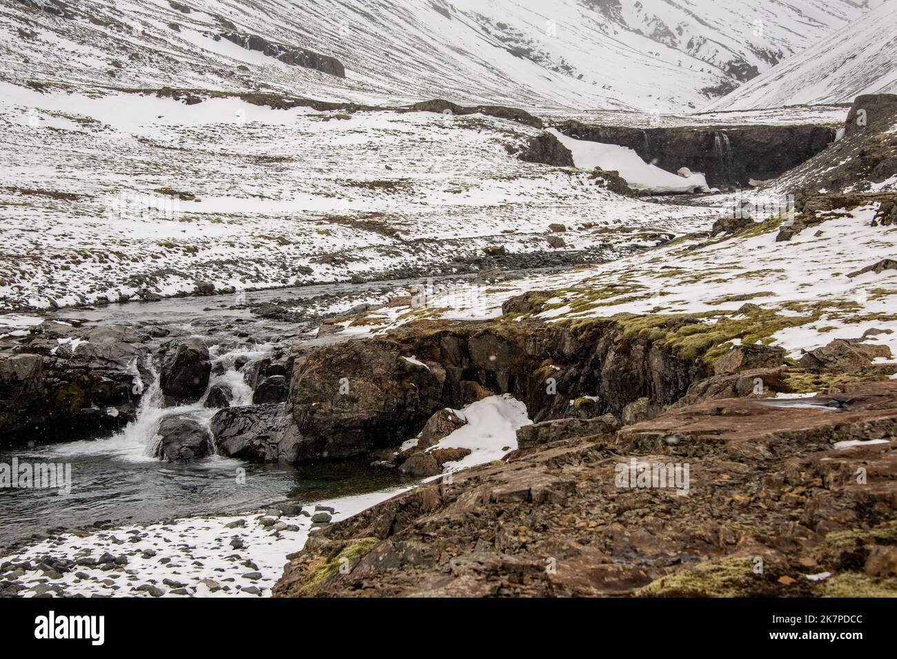 Kverna River valley in light snow leading to Kvernufoss, Iceland Stock ...