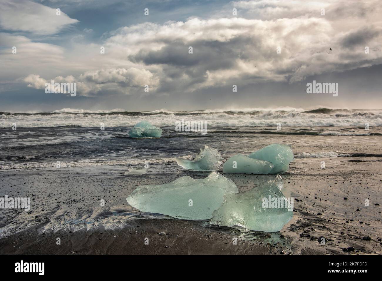 Blue ice blocks washed up by storm waves onto Diamond Beach ...