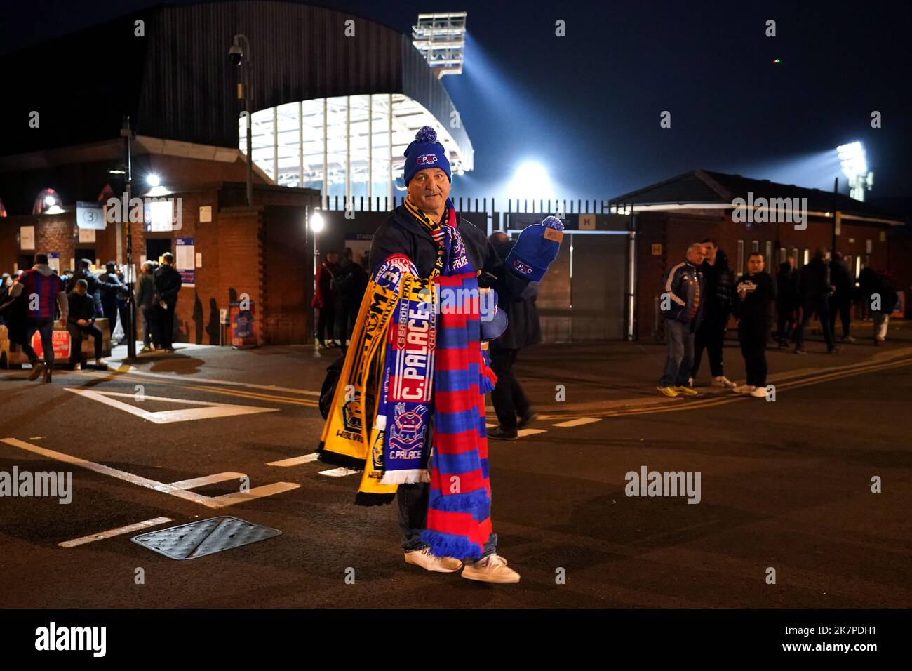A street vendor sells merchandise outside of the grounds ahead of the ...