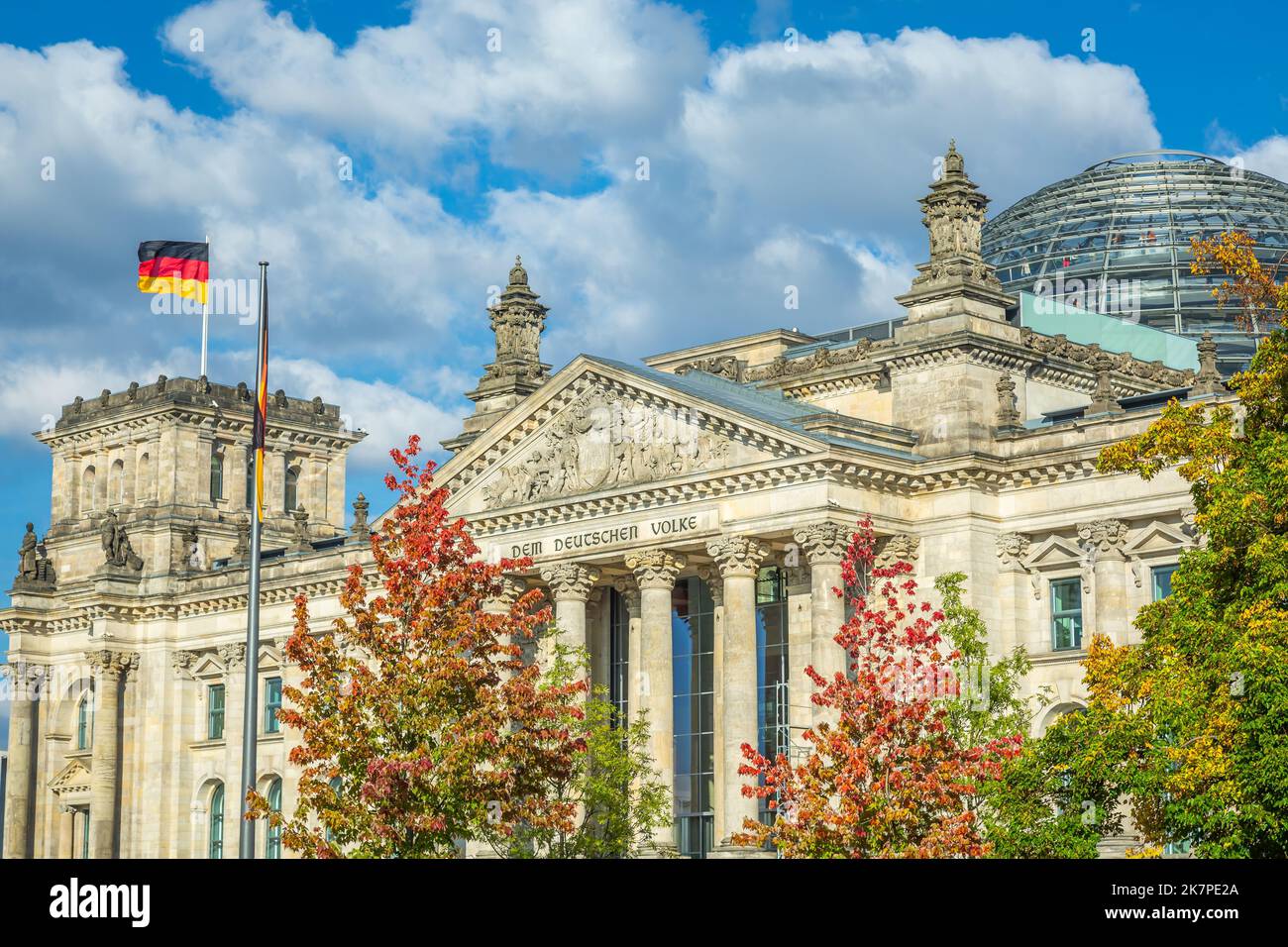 Reichstag building, seat of the German Parliament with national flag ...
