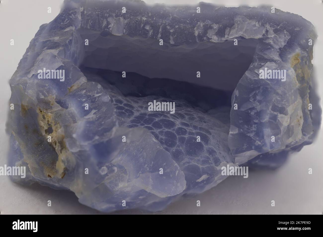 mineral sample of blue chalcedony on a white background Stock Photo - Alamy