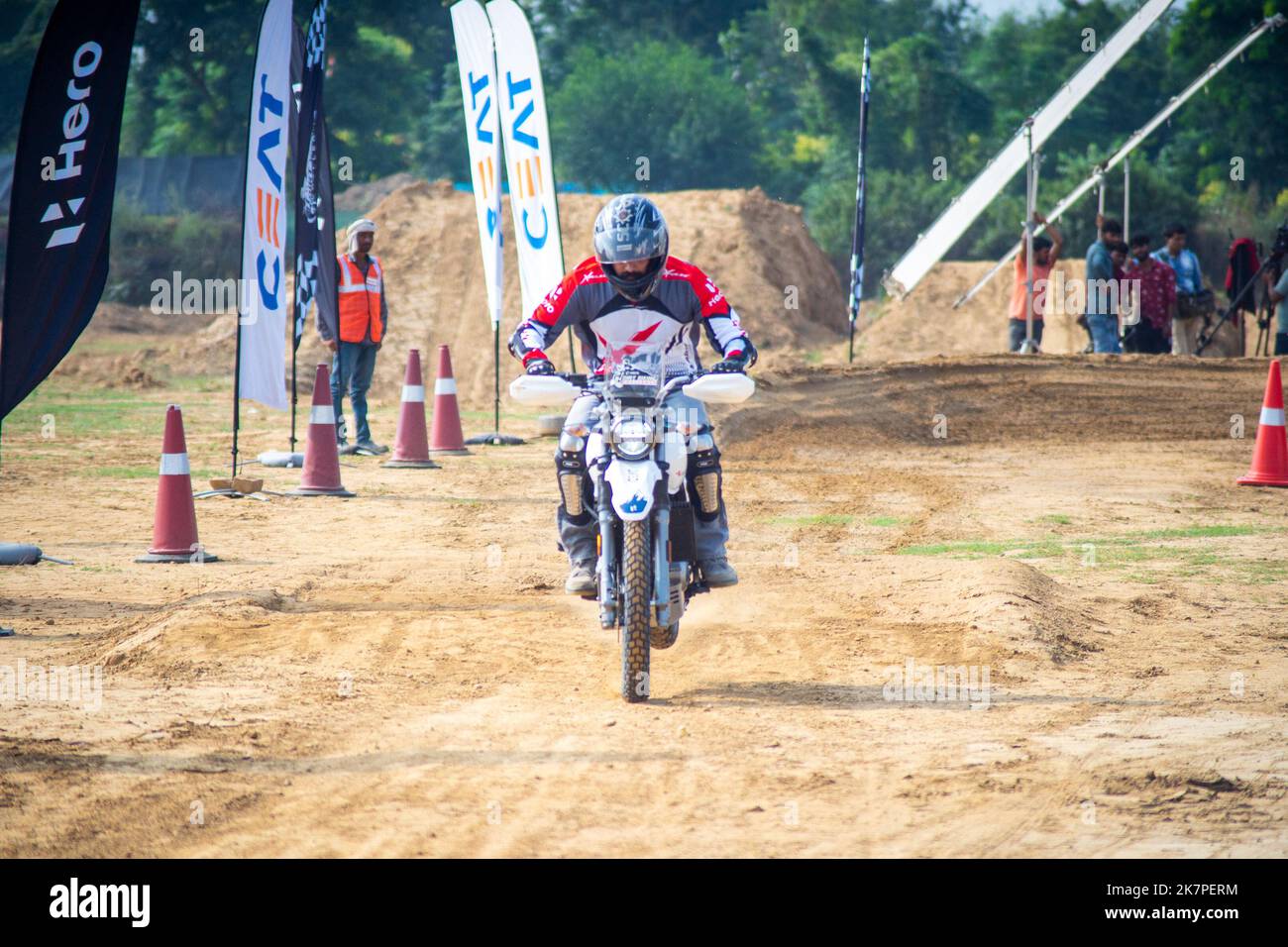 shot of off road dirt bike rider navigating rough track and then ...