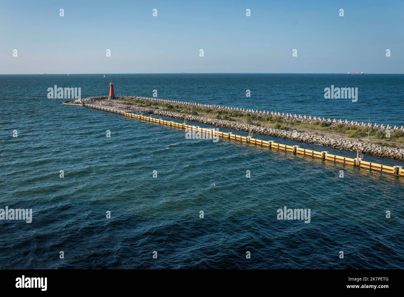 jetty at the exit of a port, breakwater Stock Photo - Alamy
