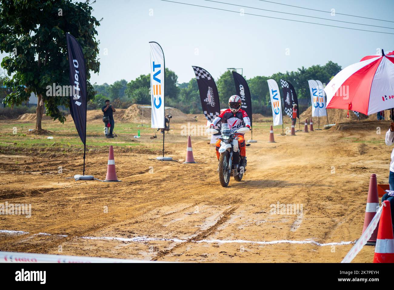 shot of off road dirt bike rider navigating rough track and then ...