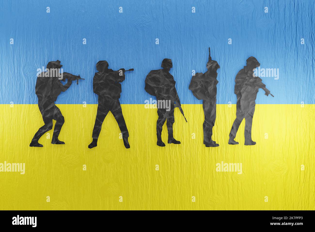 Paper cutting of soldiers in silhouette on wooden board printed with ...