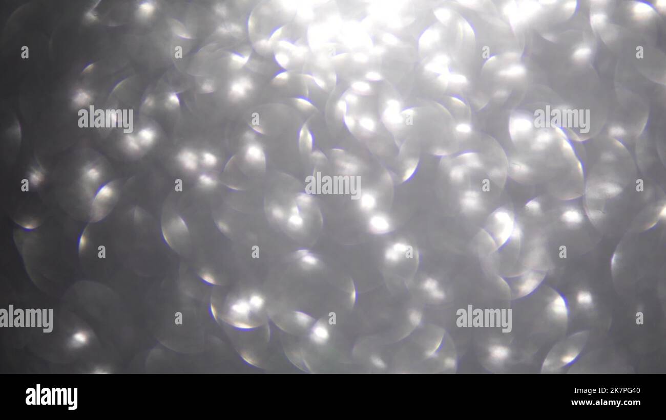 Moving dynamic silver coloured futuristic psychedelic holographic ...