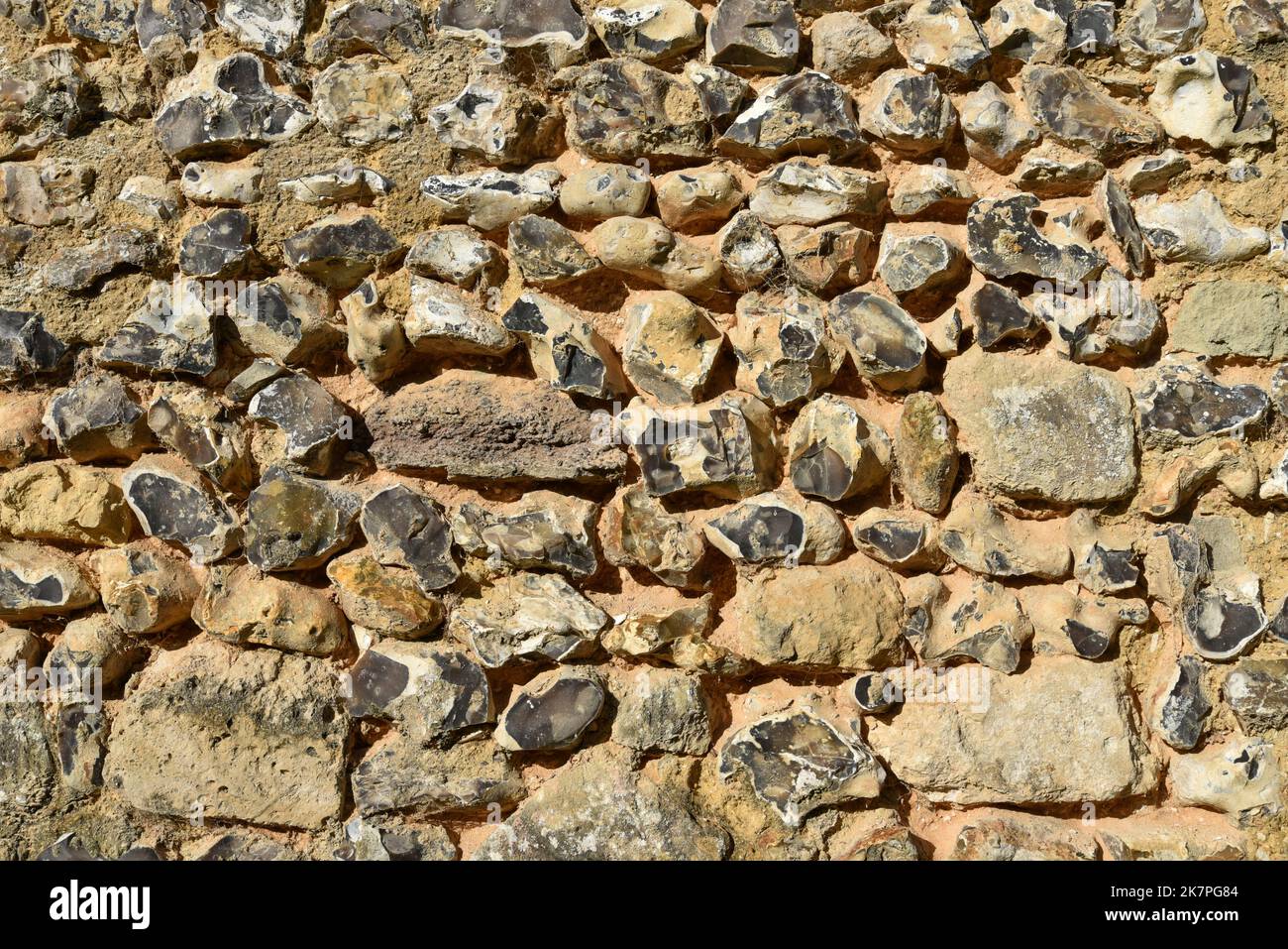 Close up of a wall constructed using flint inside an old English castle ...