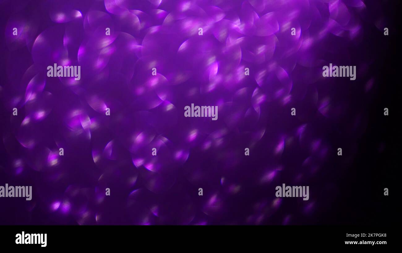 Abstract violet softly sparkling particles of light, futuristic dreamy ...