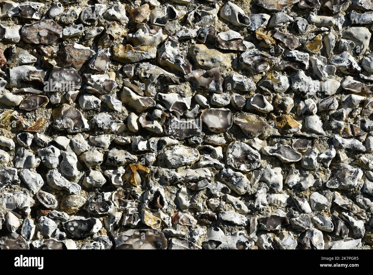 Close up of a wall constructed using flint inside an old English castle ...