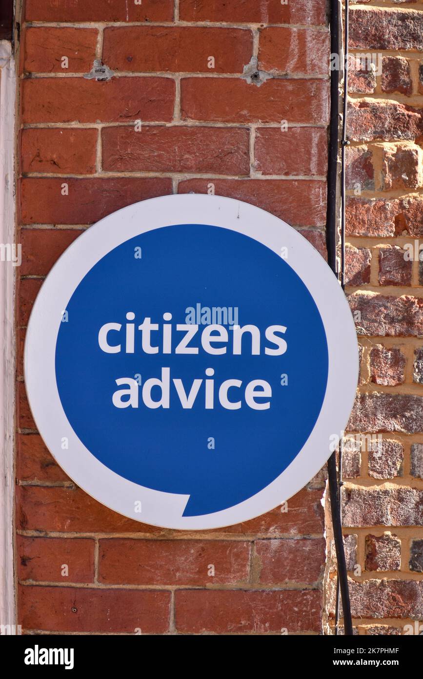 Citizens advice sign on a wall of a rural village in Hampshire, England ...