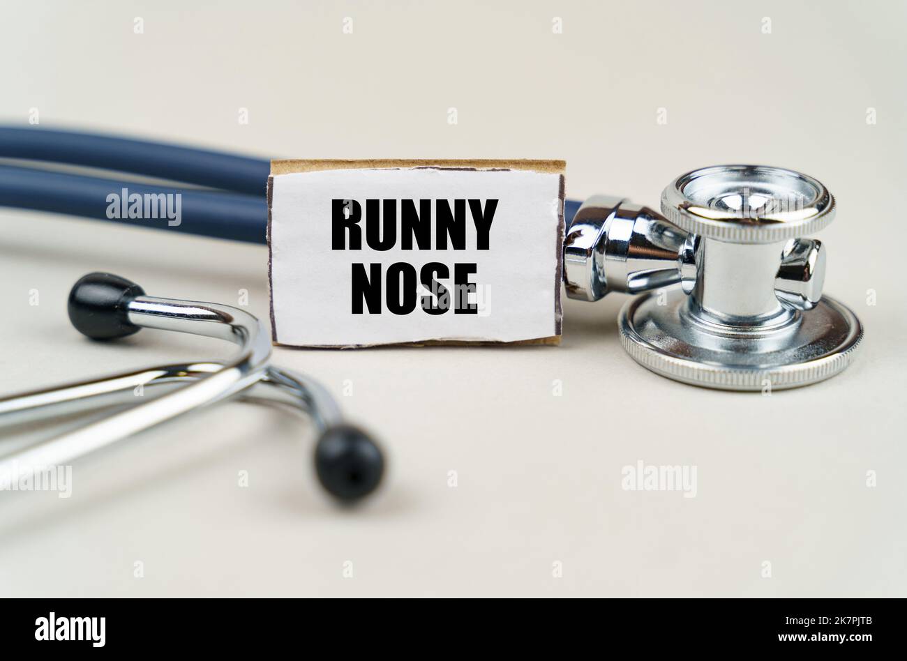 Medical concept. On a gray background, a stethoscope and a cardboard ...