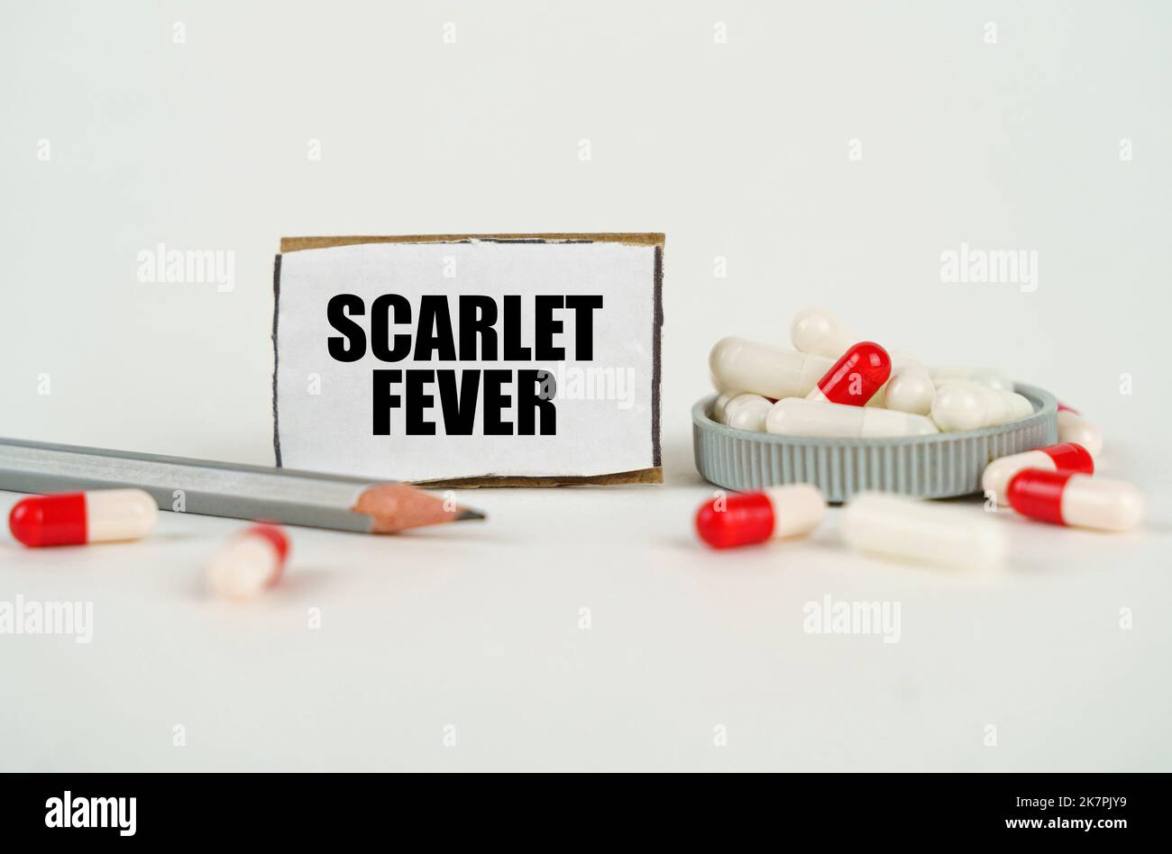 Medical concept. On a white background, medical capsules, a pencil and ...