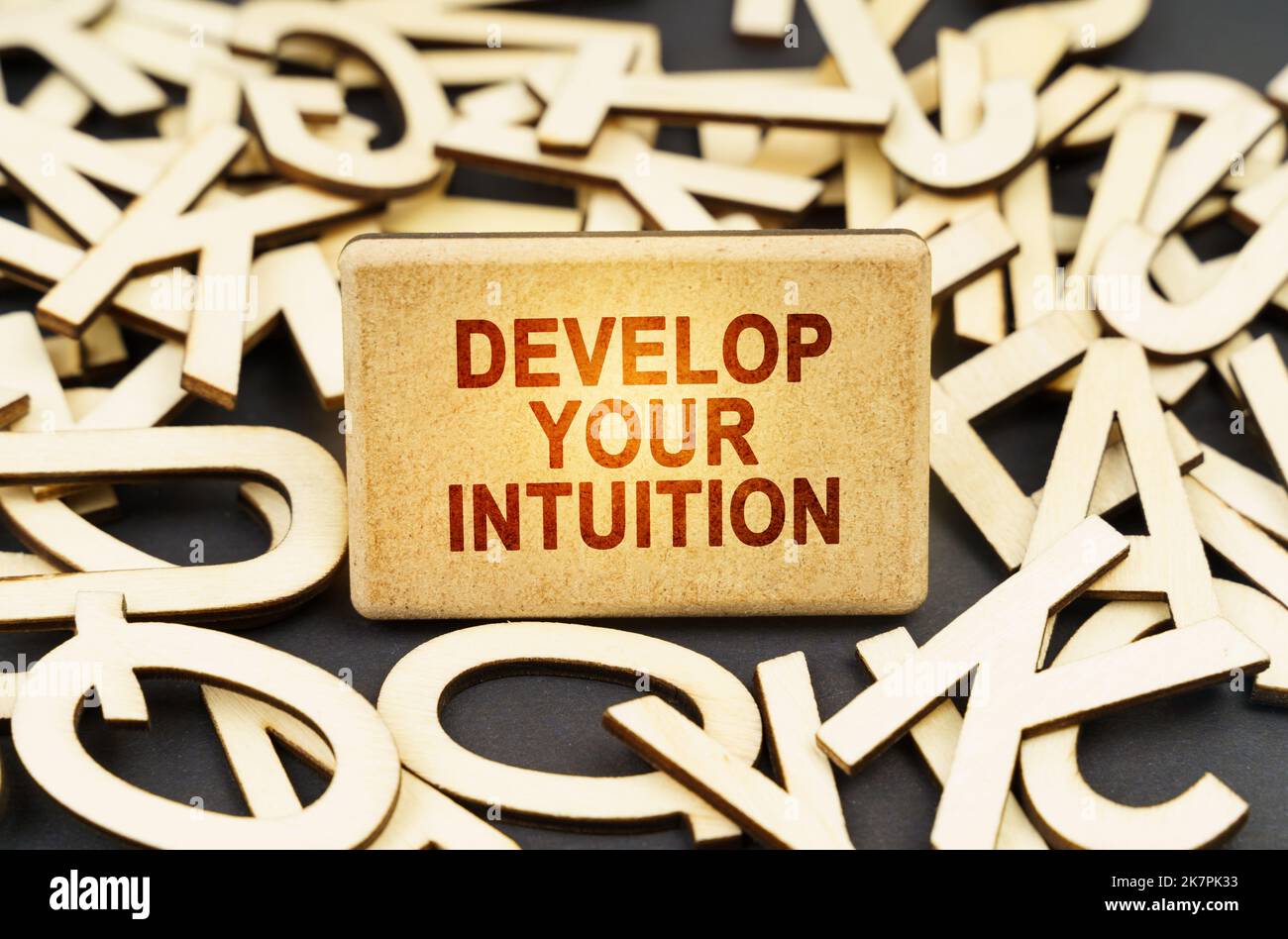 Education concept. Among the wooden letters is a sign with the ...