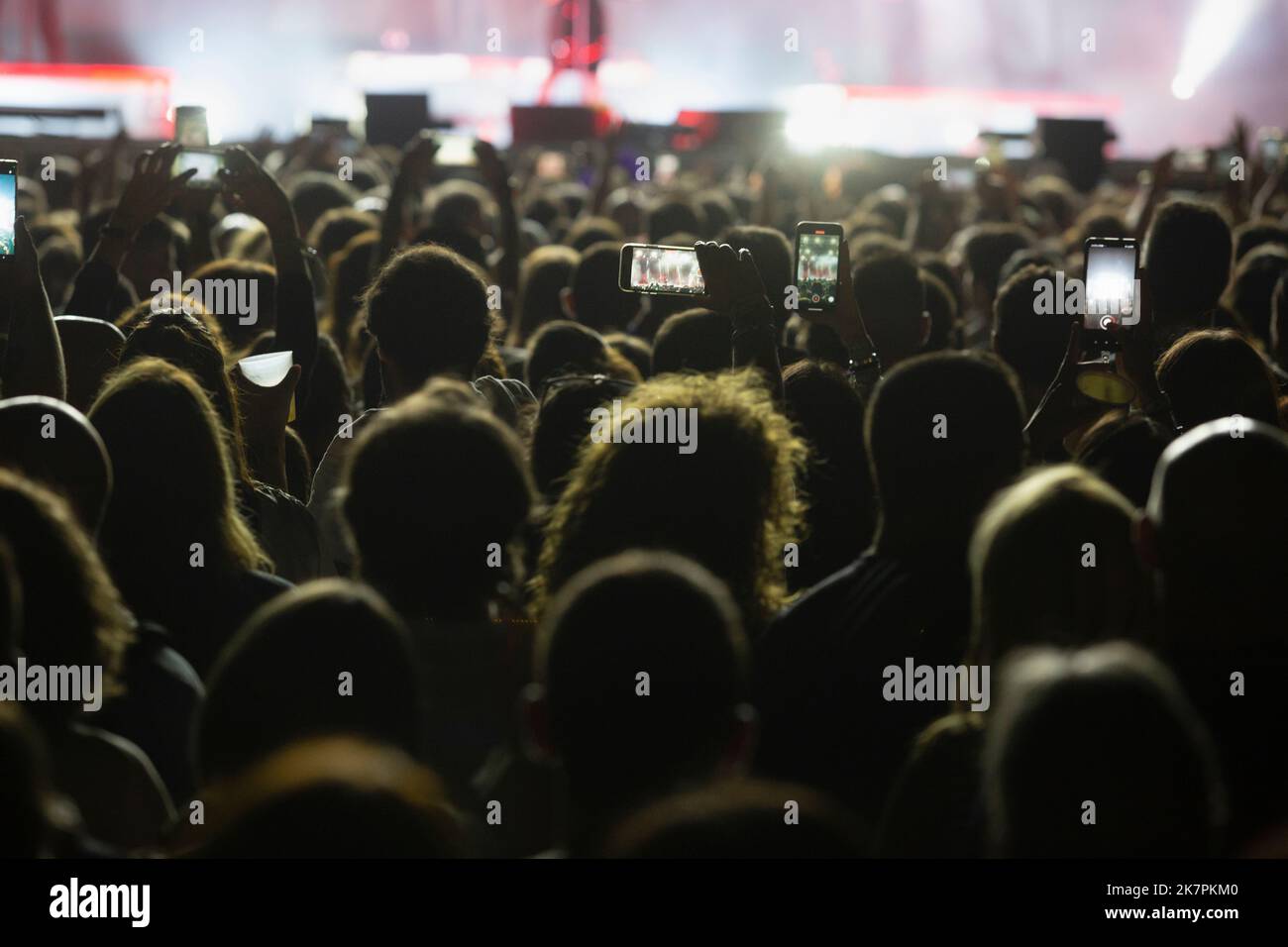 People with mobile phones at a concert. Hands with mobile phone. public ...