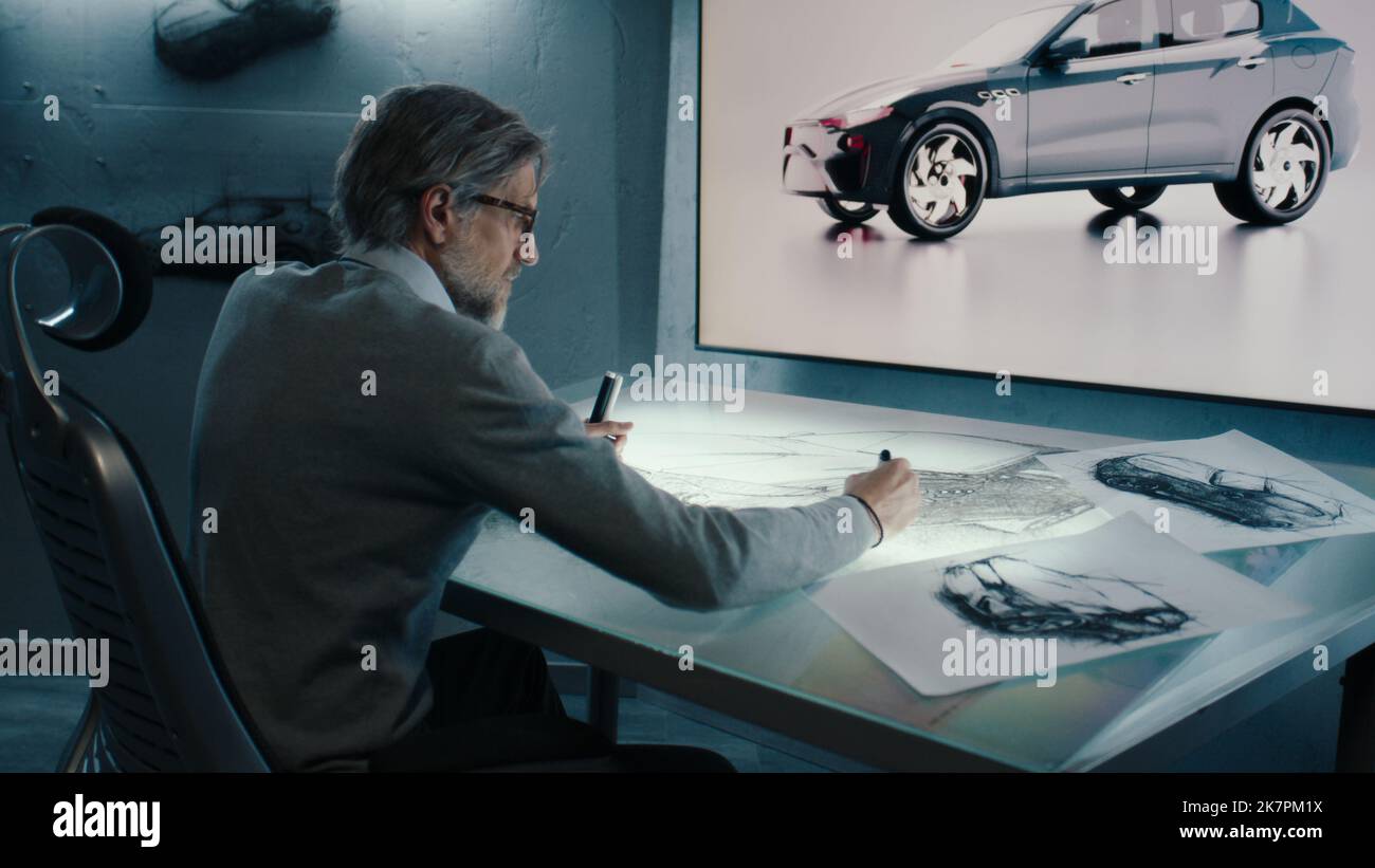 Automotive graphic designer draws sketch of the prototype model of a ...