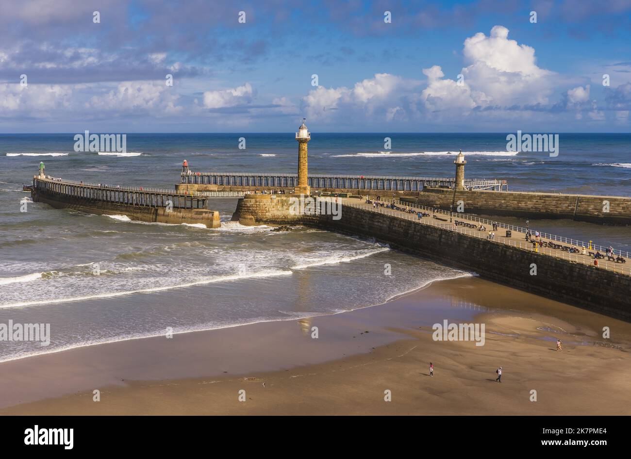 Clifftop view of the piers and lighthouses at Whitby, North Yorkshire ...