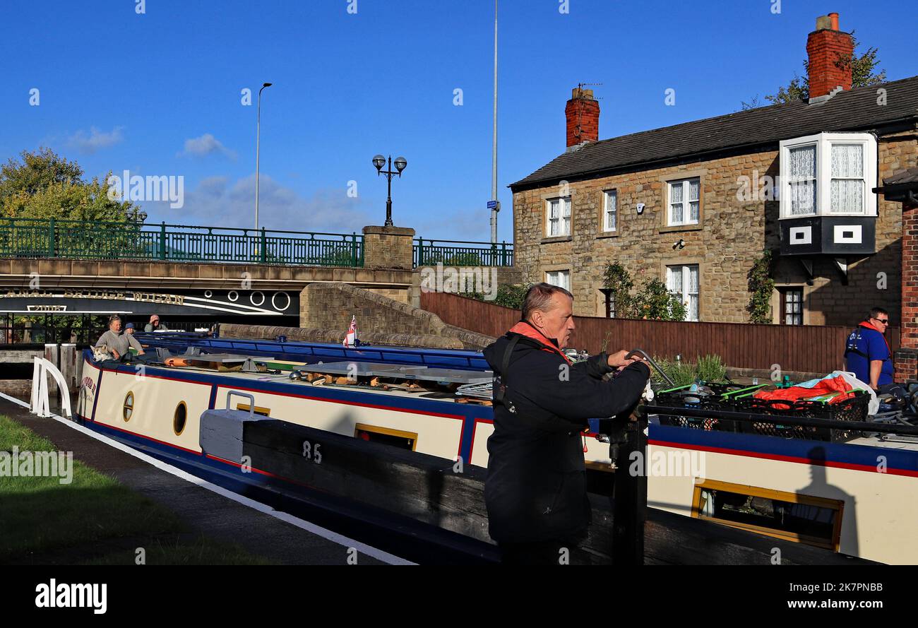 Two narrow boats are being worked through Henhurst lock near the bottom ...